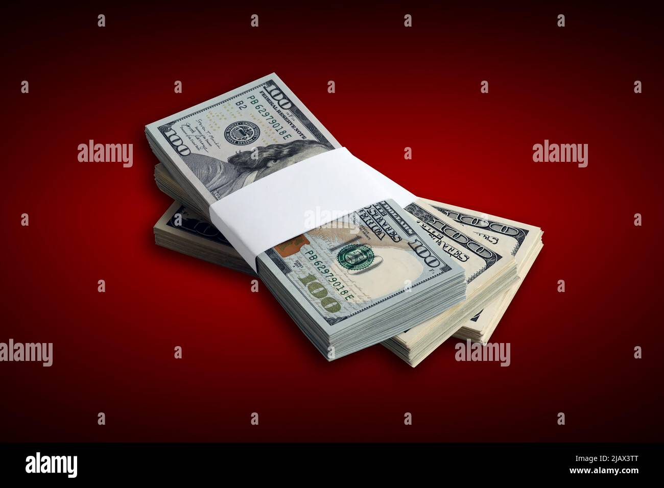 Bundle of US dollar bills on crimson red background. Pack of american ...
