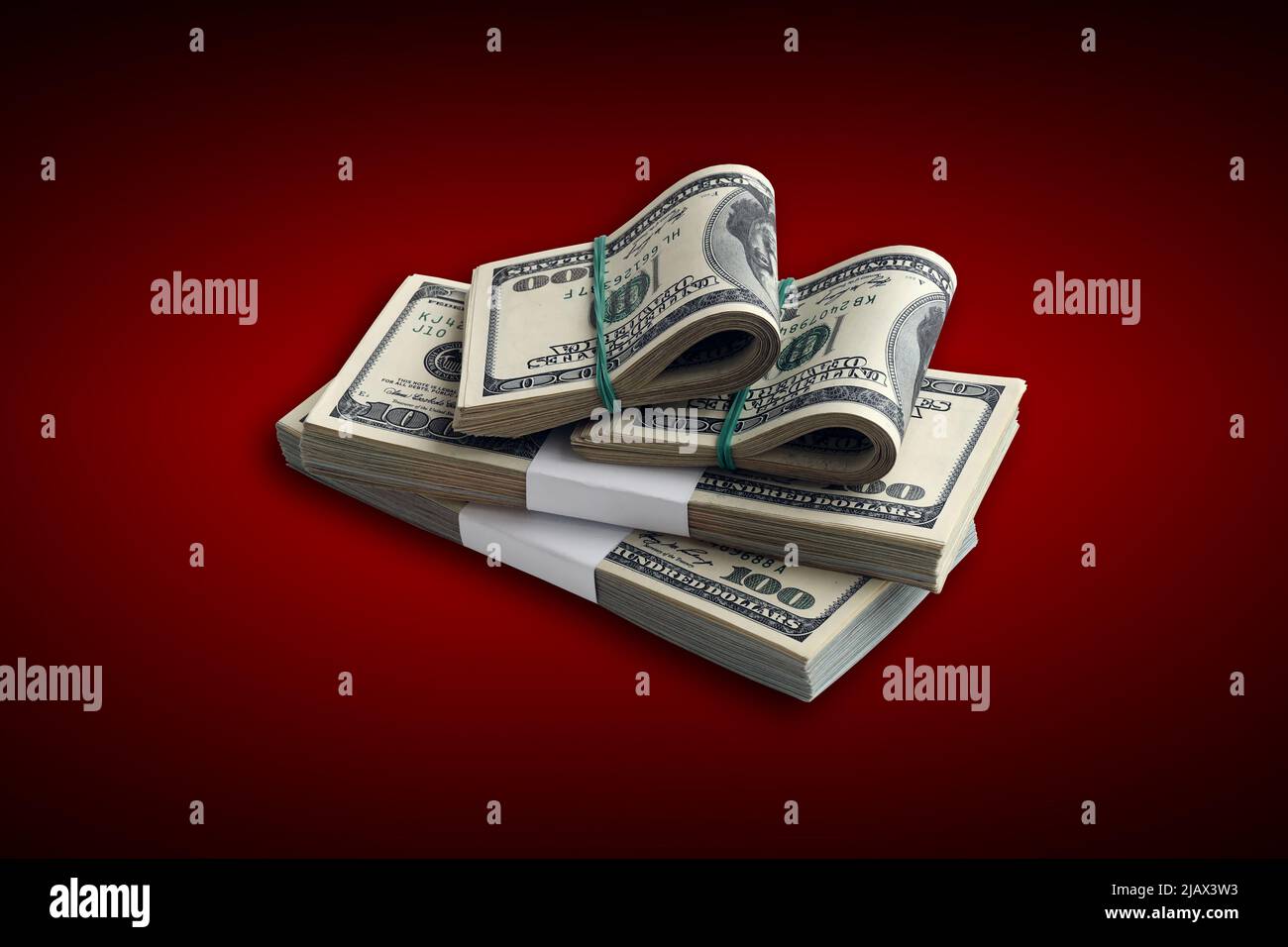 Bundle of US dollar bills on crimson red background. Pack of american money with high resolution ...