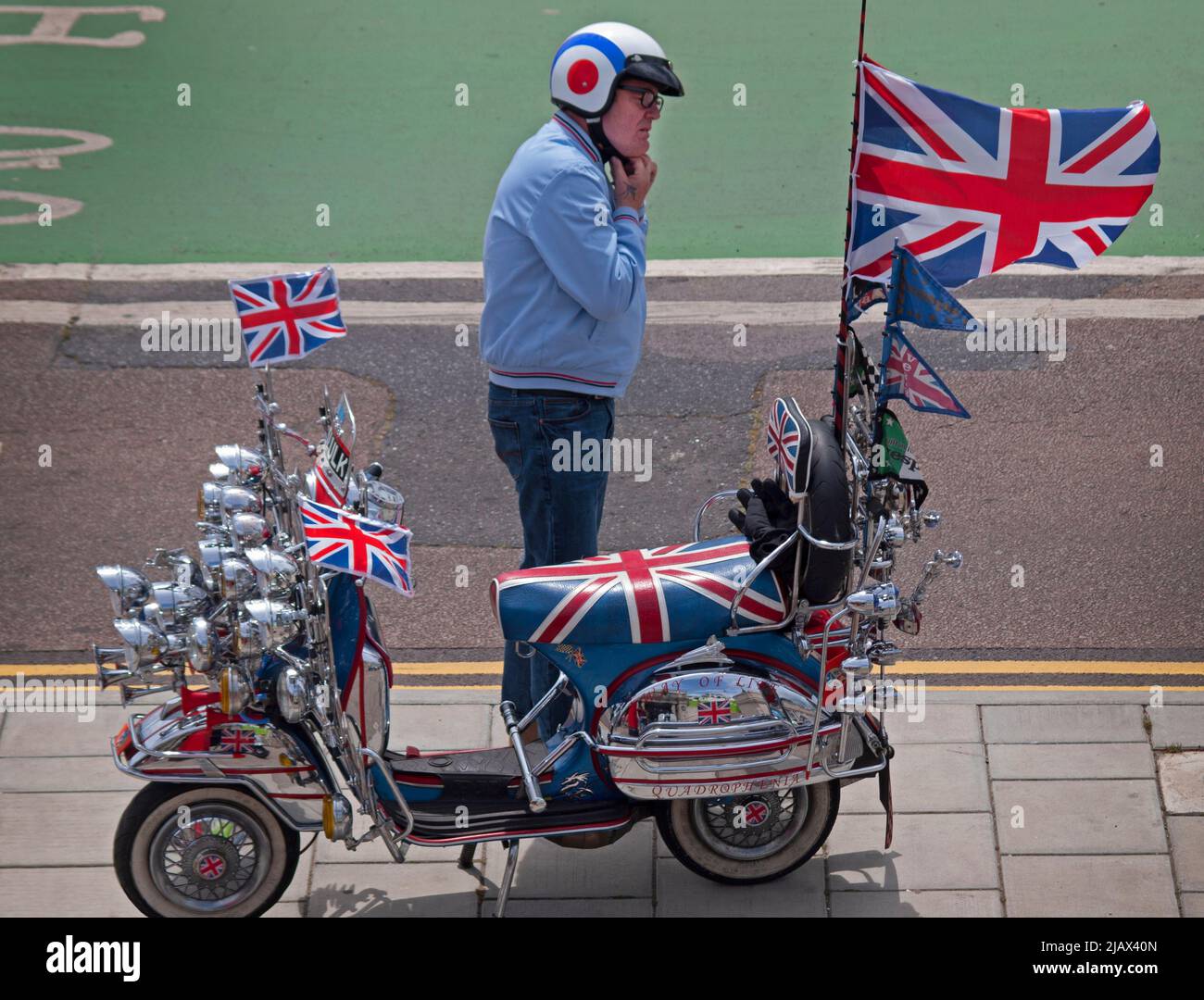 A Mod scooter parked up on the Brighton seafront, England Stock Photo ...