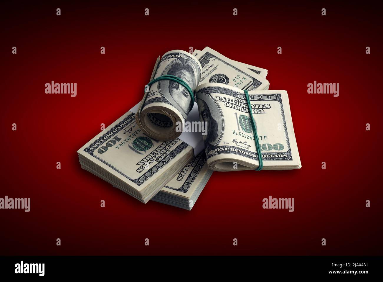 Bundle of US dollar bills on crimson red background. Pack of american ...