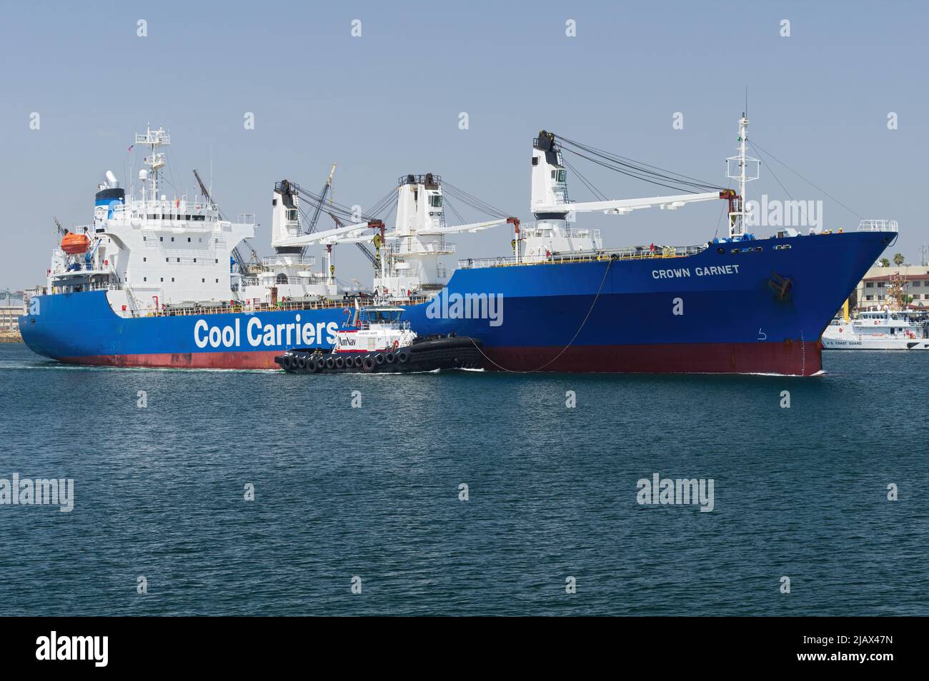 Refrigerated cargo ship Crown Garnet in transit on a sunny day with ...