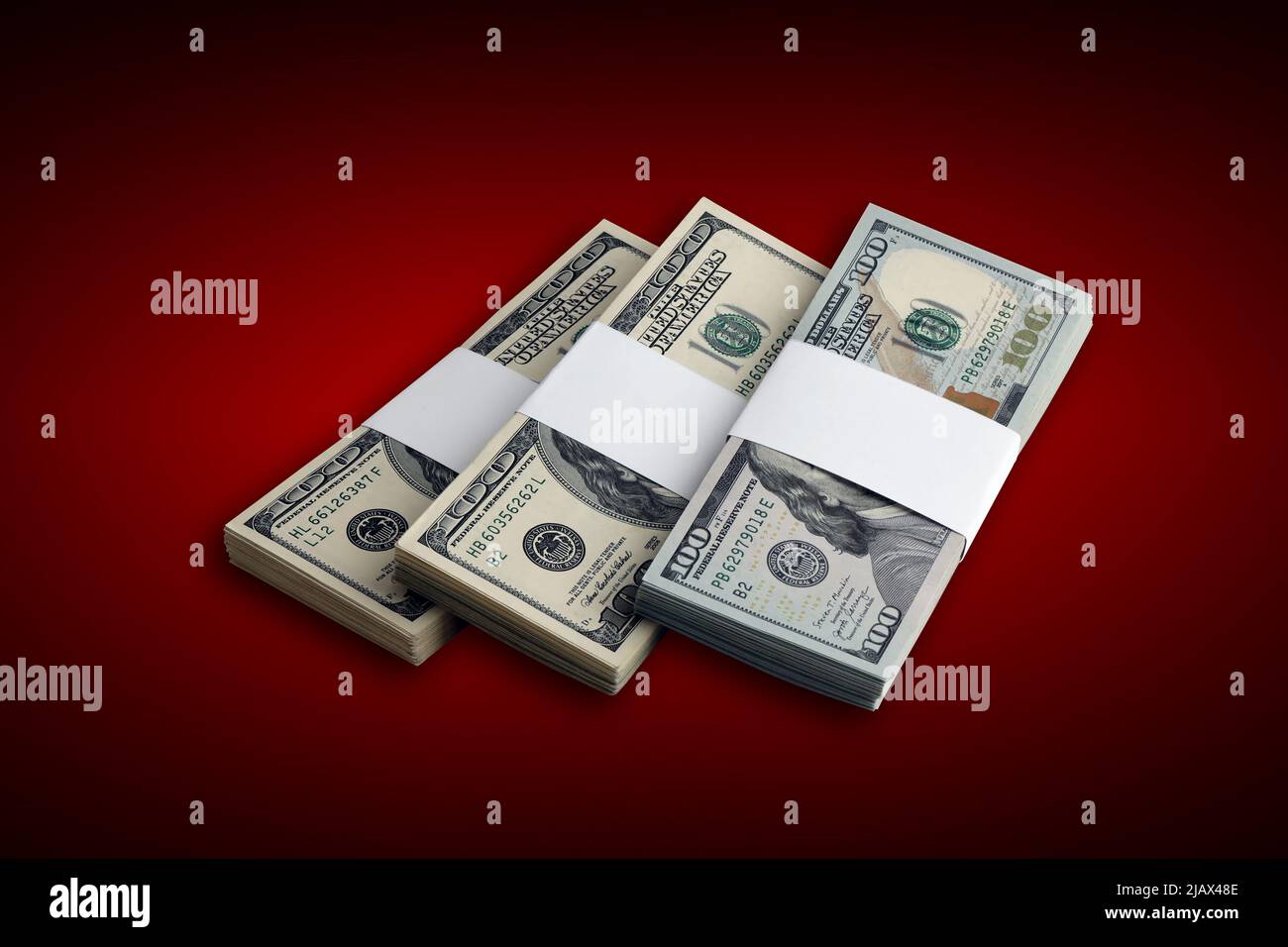 Bundle of US dollar bills on crimson red background. Pack of american ...