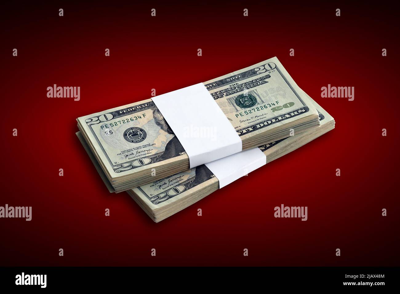 Bundle of US dollar bills on crimson red background. Pack of american ...