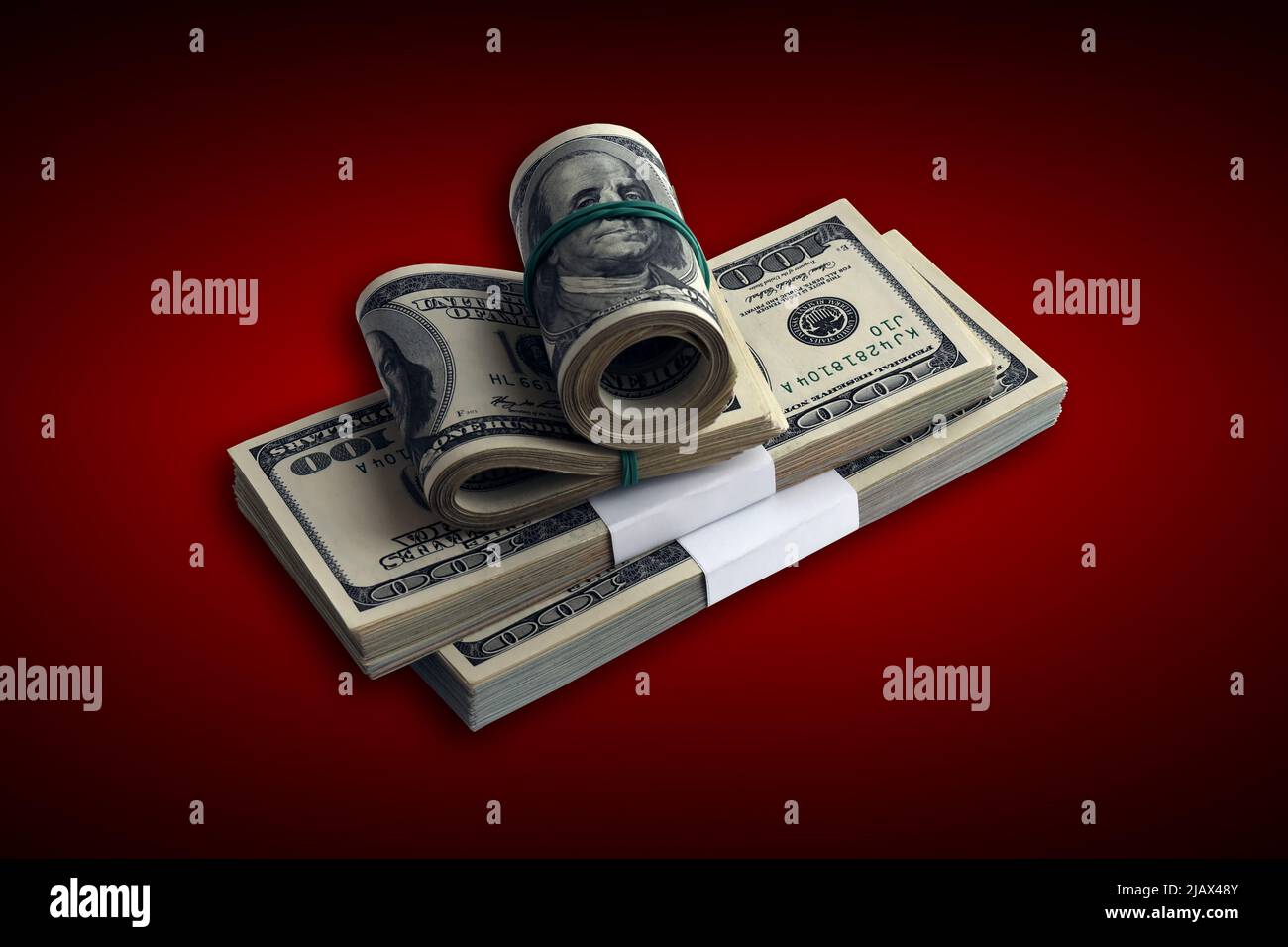 Bundle of US dollar bills on crimson red background. Pack of american ...