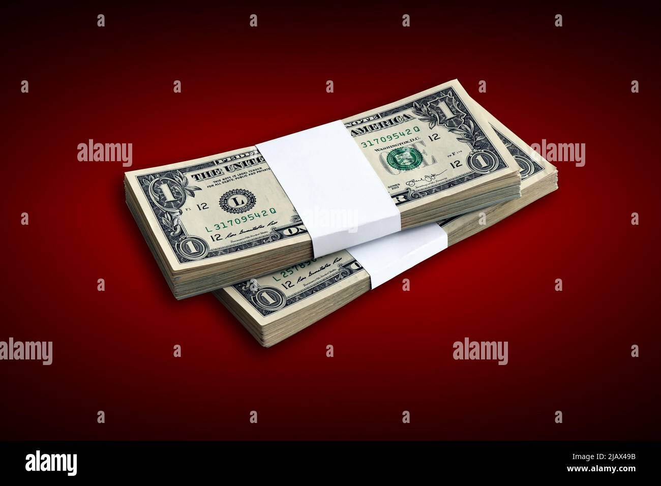 Bundle of US dollar bills on crimson red background. Pack of american ...