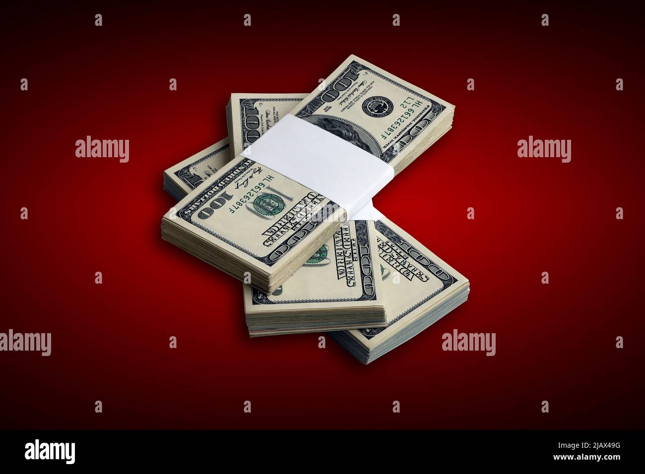 Bundle of US dollar bills on crimson red background. Pack of american ...