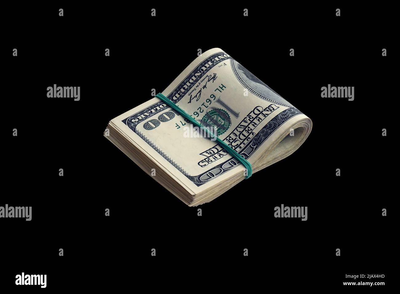 Bundle of US dollar bills isolated on black. Pack of american money with high resolution on ...