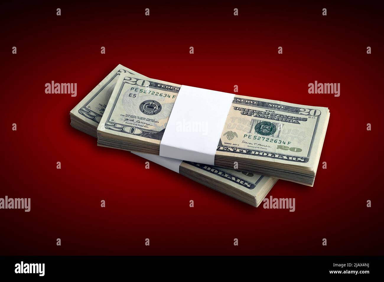 Bundle of US dollar bills on crimson red background. Pack of american ...