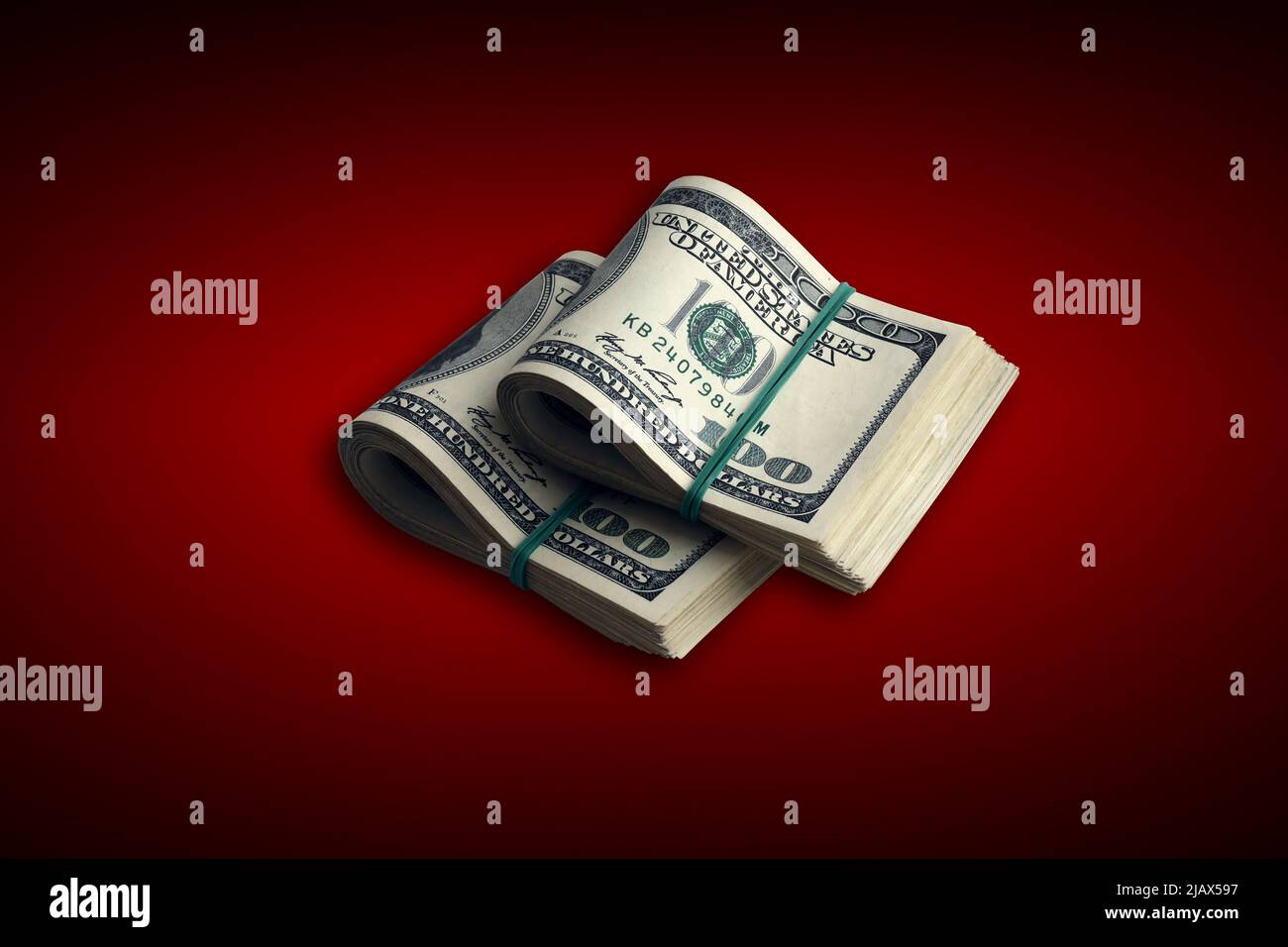 Bundle of US dollar bills on crimson red background. Pack of american ...