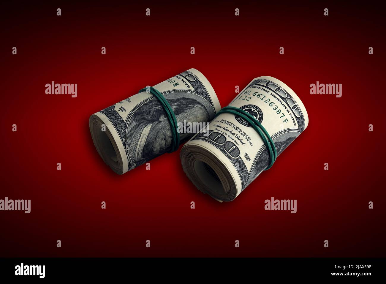 Bundle of US dollar bills on crimson red background. Pack of american ...