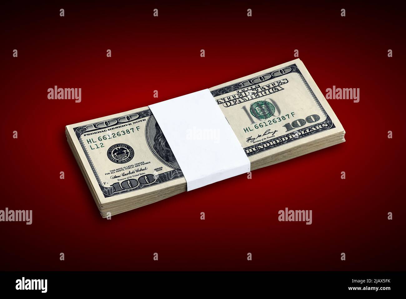 Bundle of US dollar bills on crimson red background. Pack of american ...