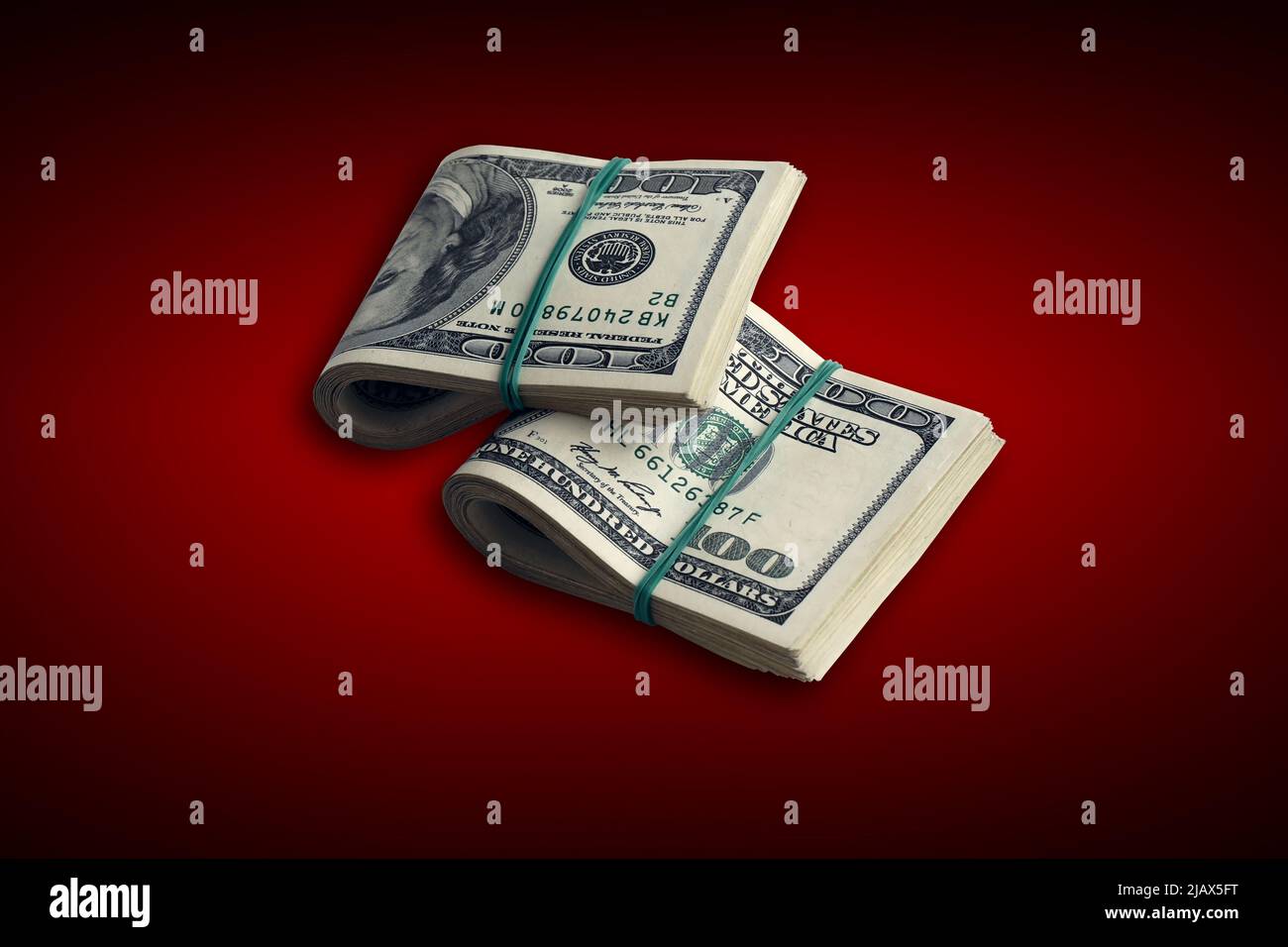 Bundle of US dollar bills on crimson red background. Pack of american ...