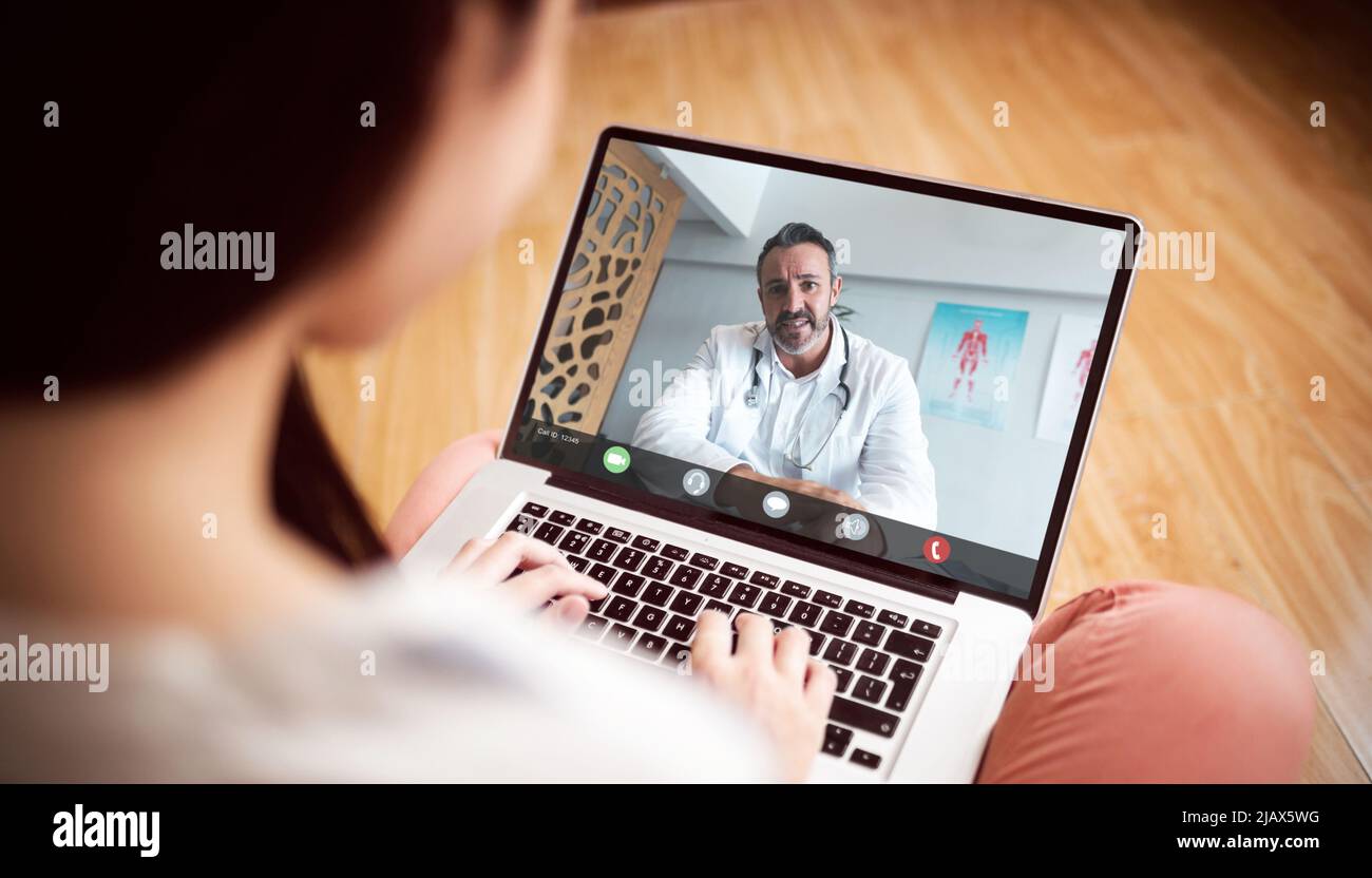 Asian woman consulting with caucasian mature male doctor on video call ...