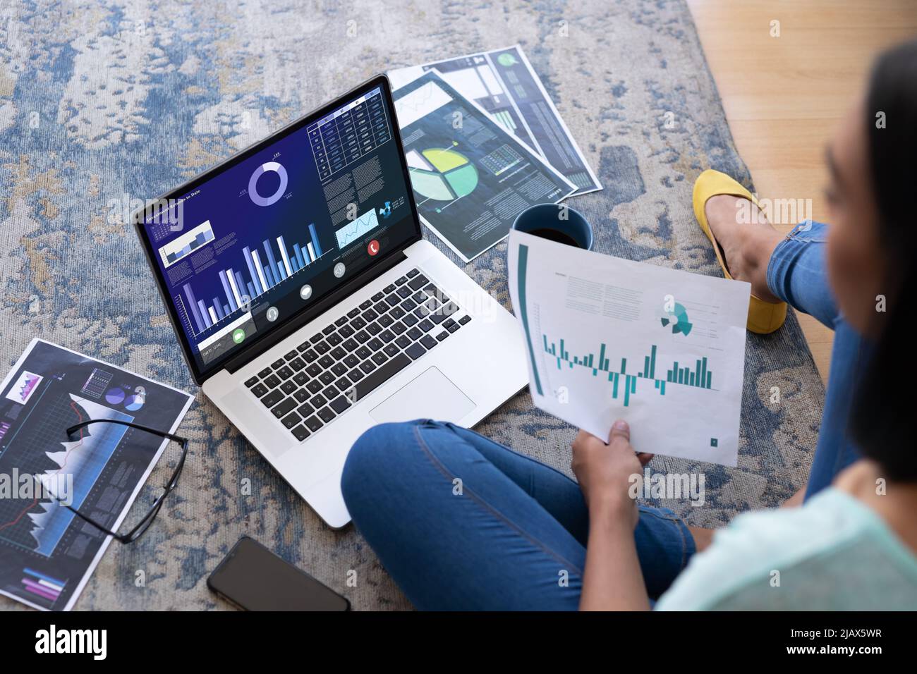 Working at office desk studying charts hi-res stock photography and ...
