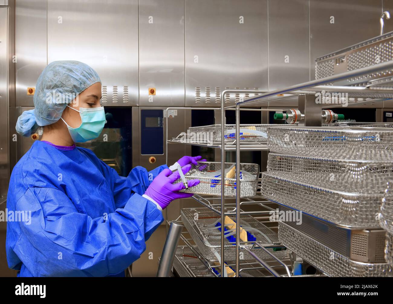 A girl works in a hospital as a medical hygiene worker. Dressed in ...