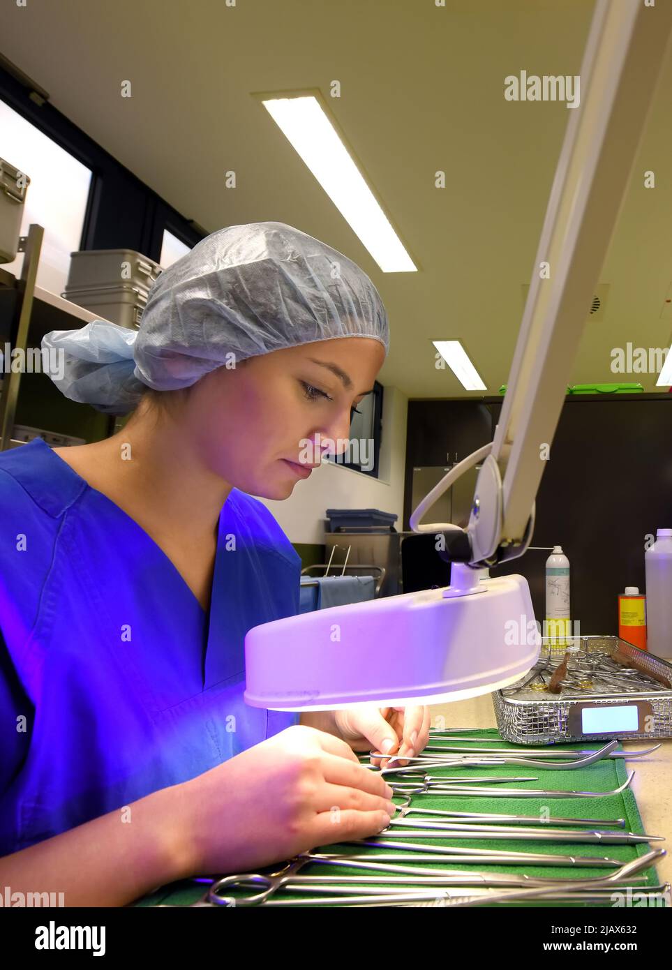 A girl works in a hospital as a medical hygiene worker. Dressed in ...