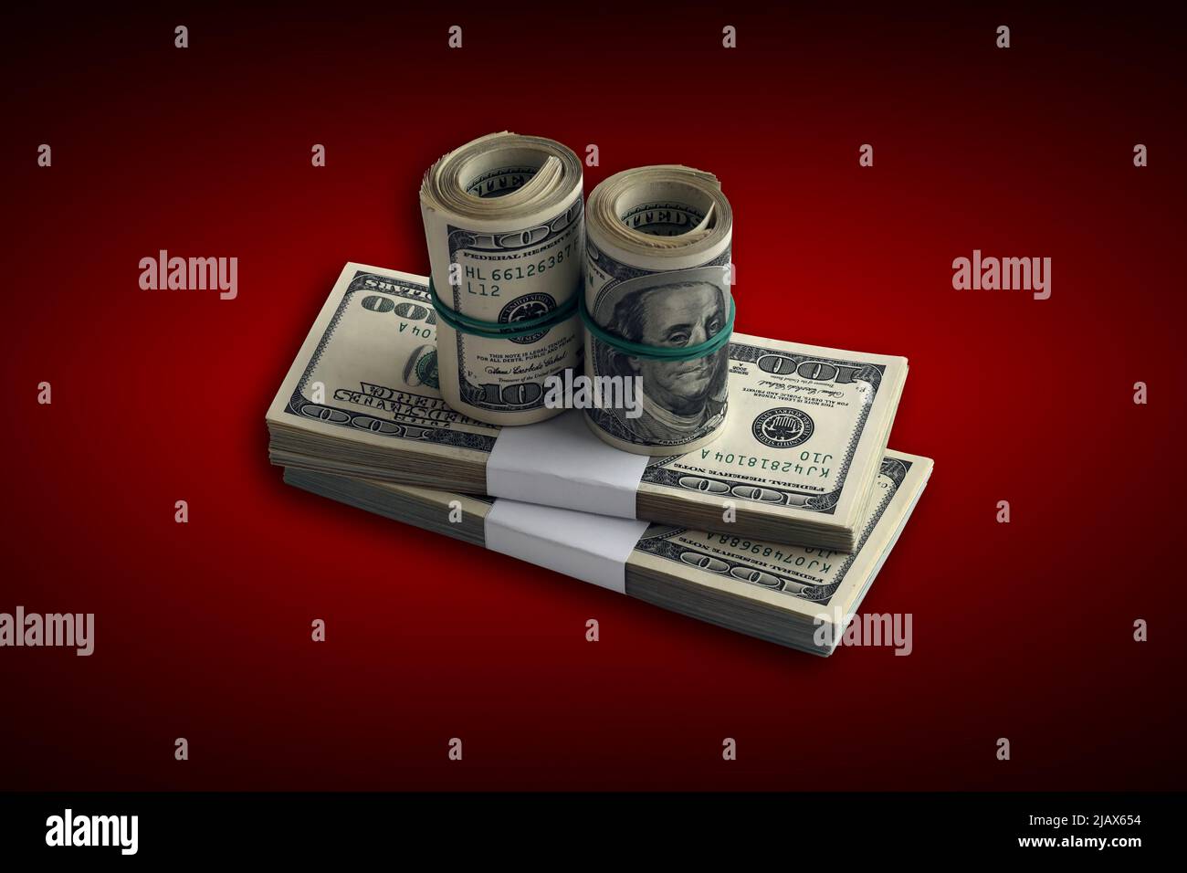 Bundle of US dollar bills on crimson red background. Pack of american ...