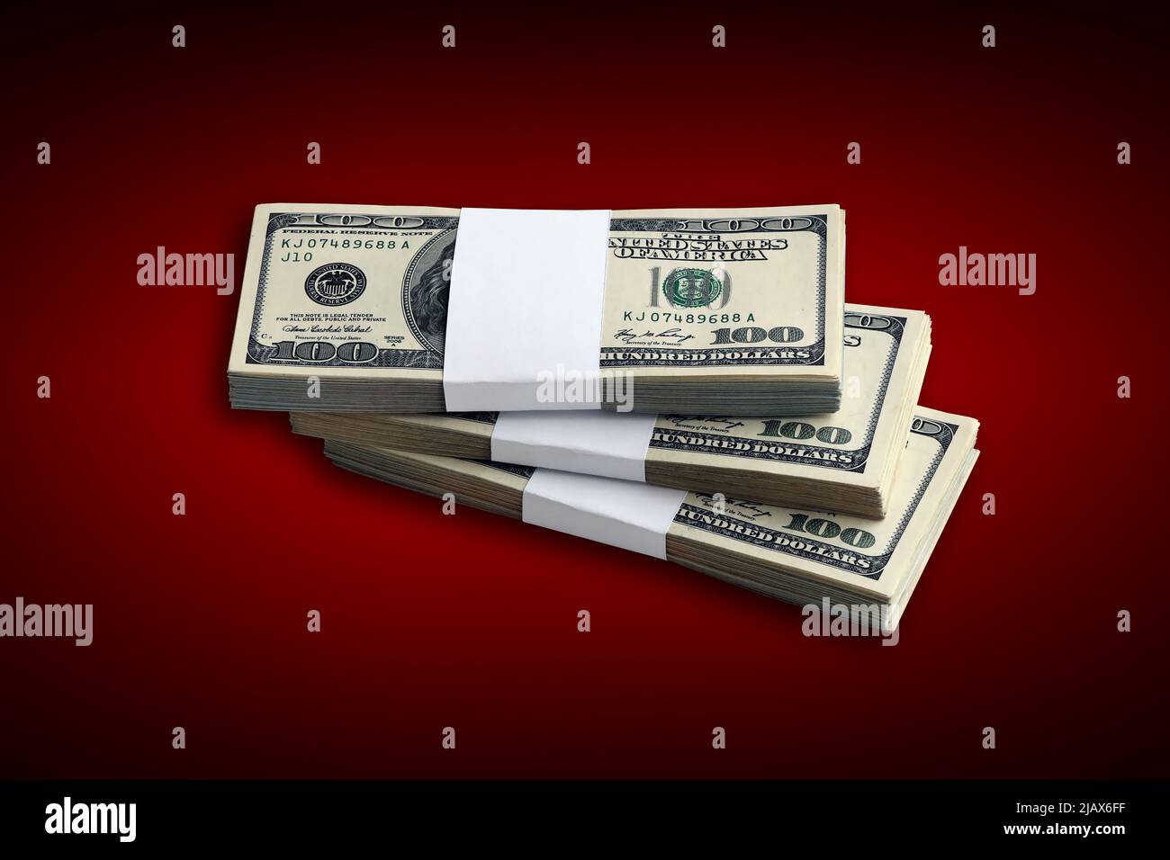 Bundle of US dollar bills on crimson red background. Pack of american ...