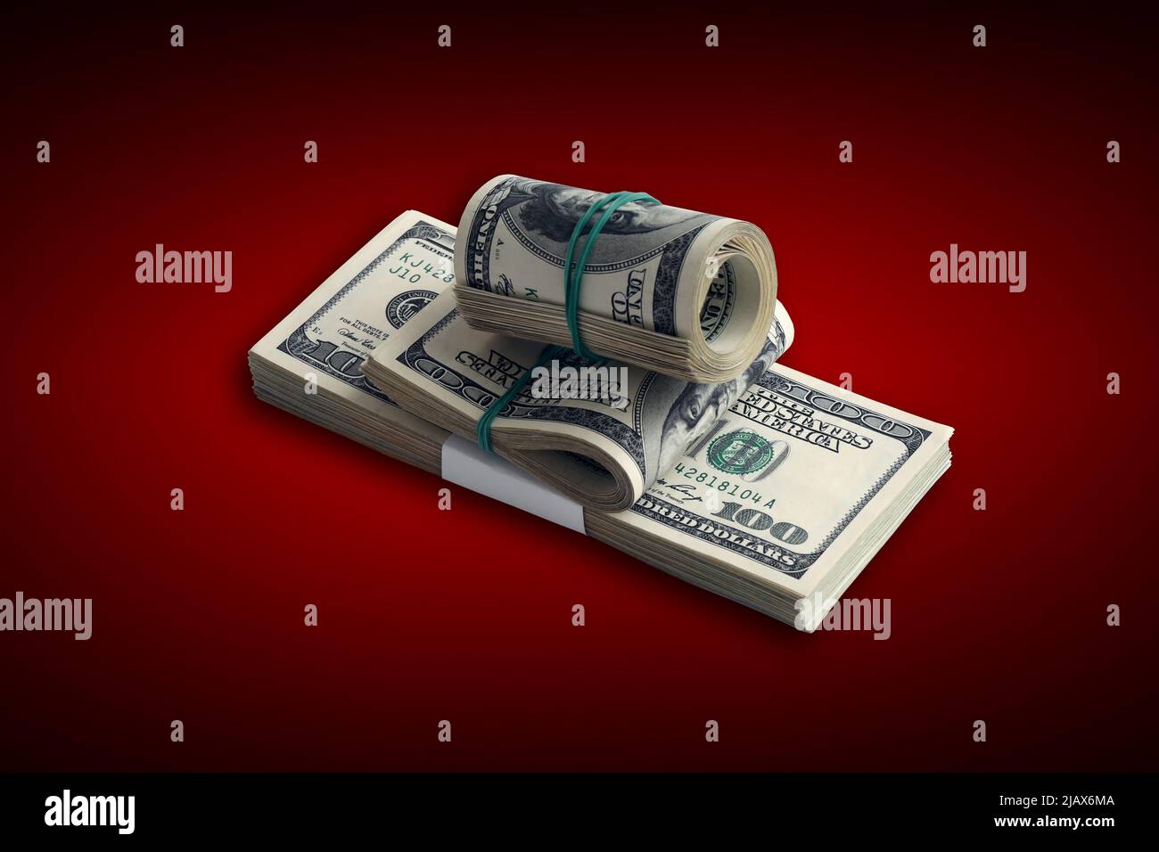 Bundle of US dollar bills on crimson red background. Pack of american ...