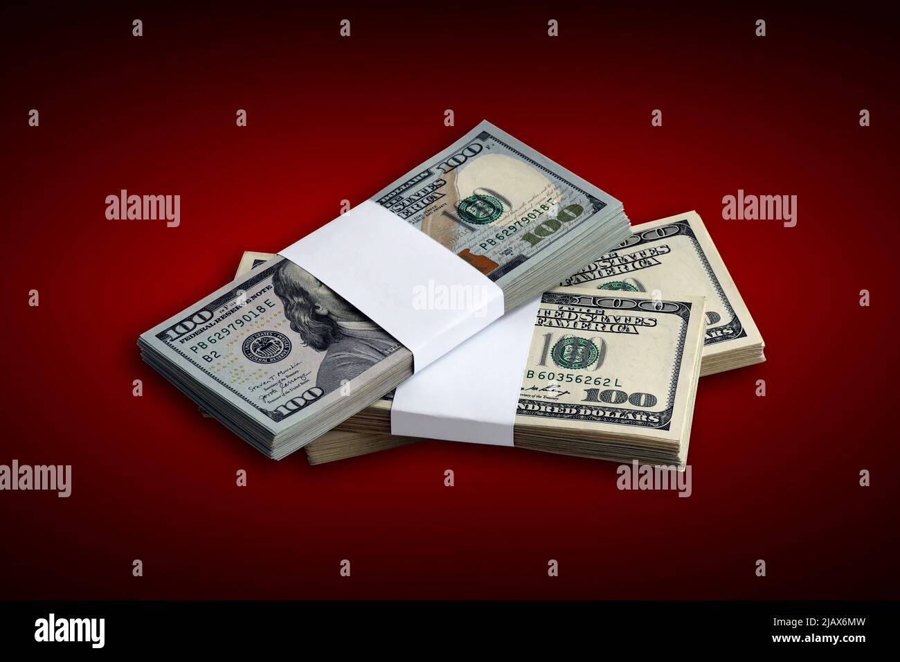 Bundle of US dollar bills on crimson red background. Pack of american ...