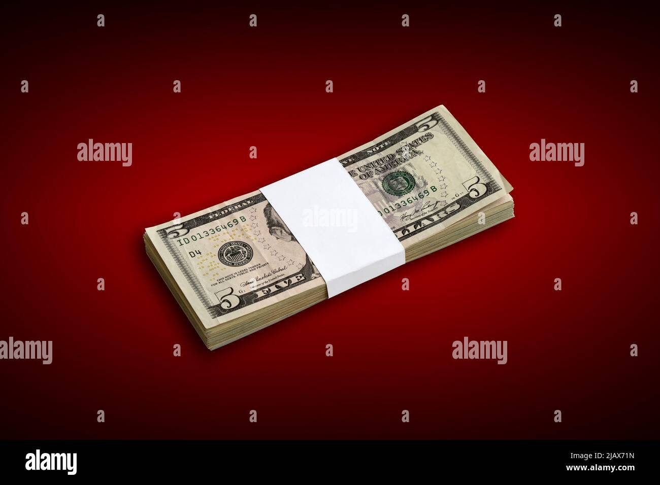 Bundle of US dollar bills on crimson red background. Pack of american ...