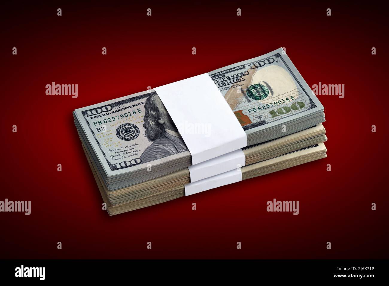 Bundle of US dollar bills on crimson red background. Pack of american ...