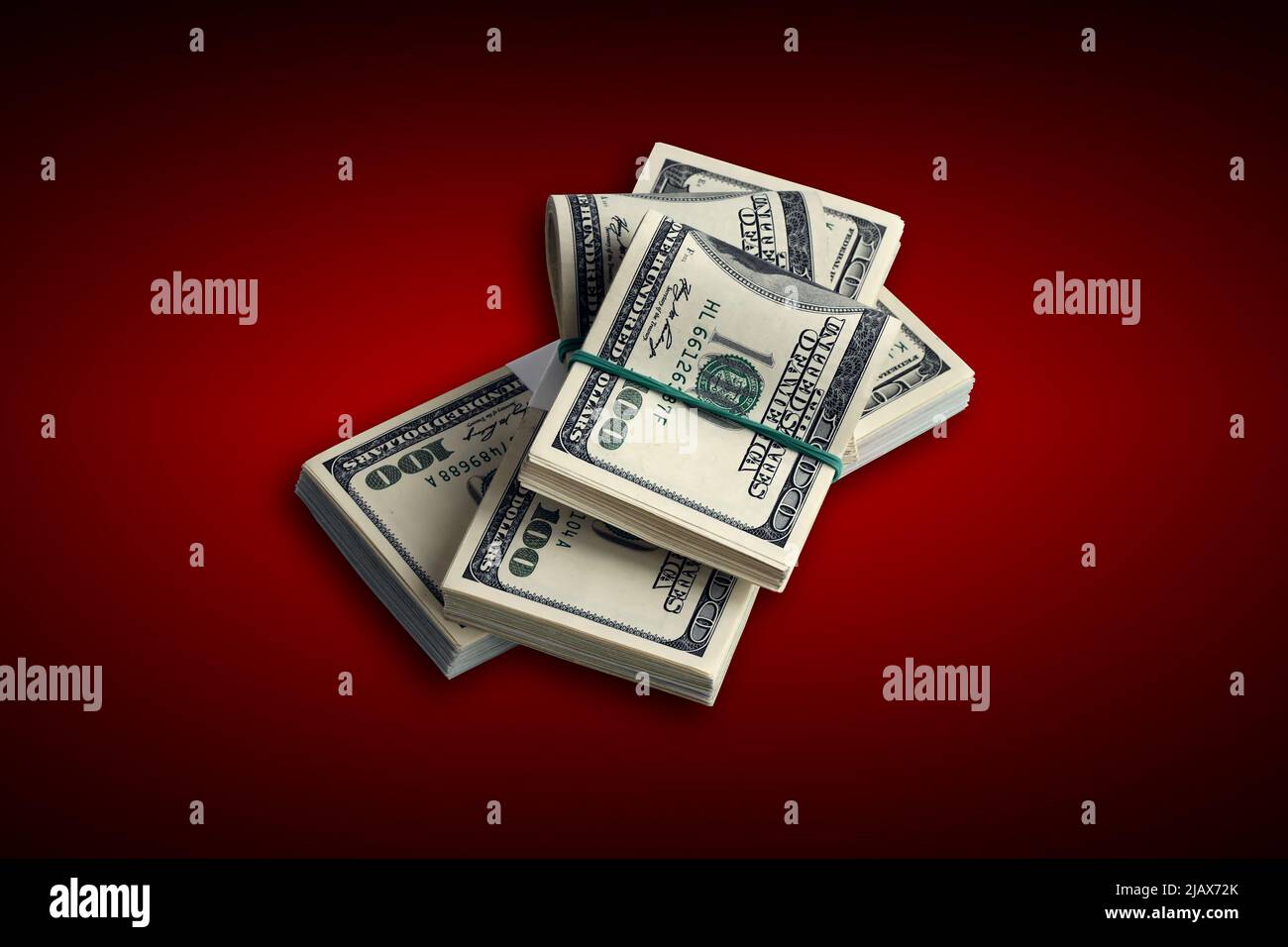 Bundle of US dollar bills on crimson red background. Pack of american ...