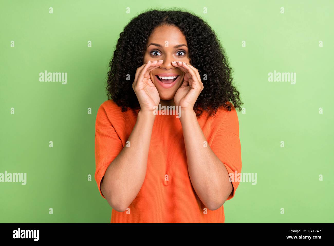 Photo of young black woman happy positive smile hands near mouth speak ...