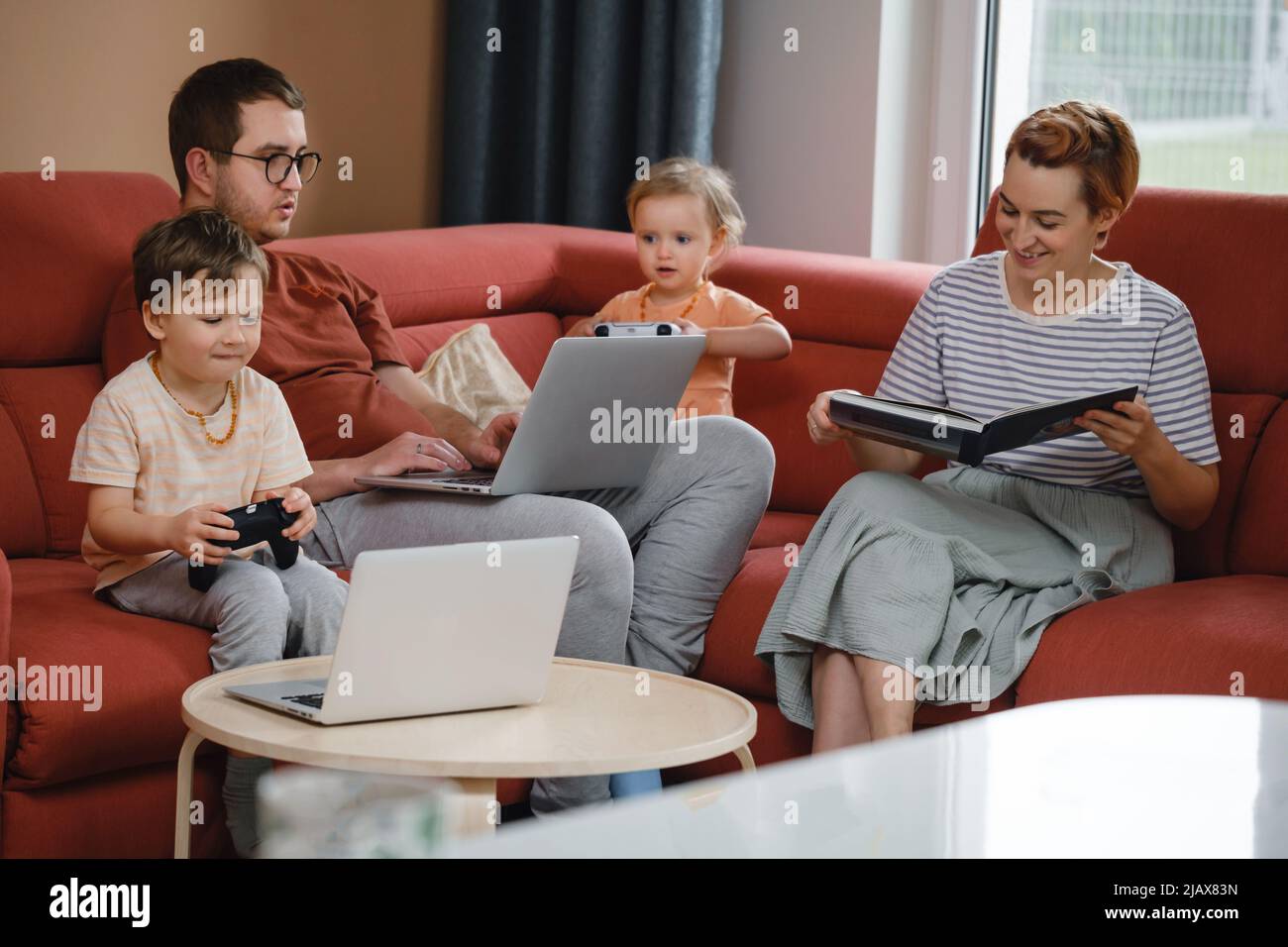 Mother watching son play video games hi-res stock photography and ...