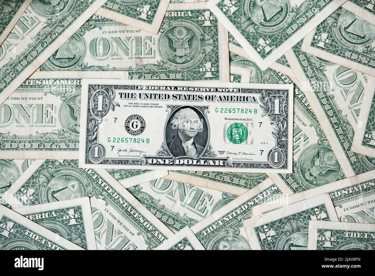 One dollar bills as background. 1 US dollar front side, surrounding ...