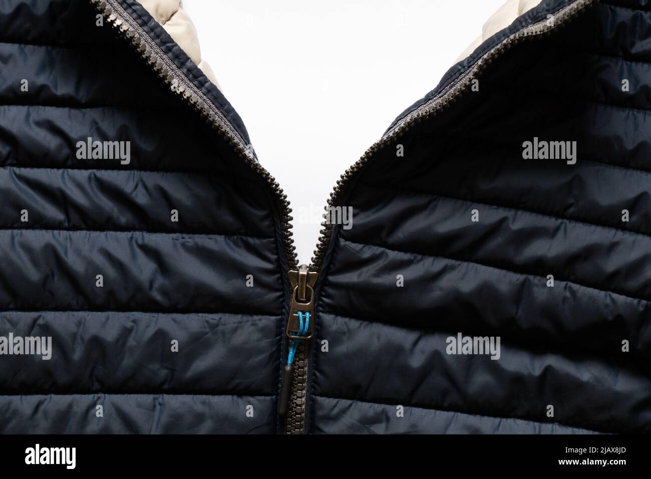 blue warm winter jacket with a lock in the middle as a background ...