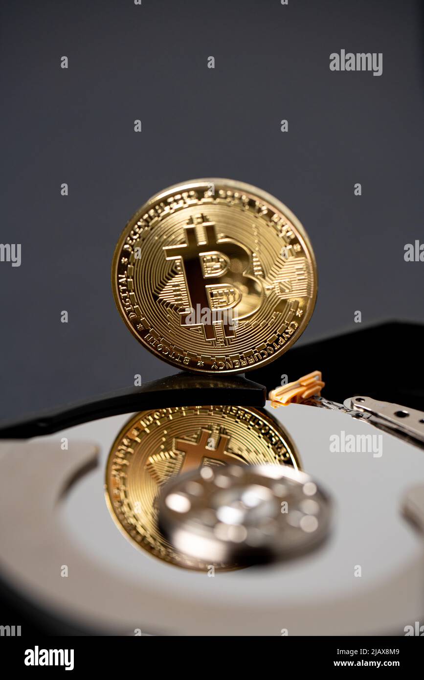 Bitcoin reflecting on hard drive platter. Crypto currency mining ...