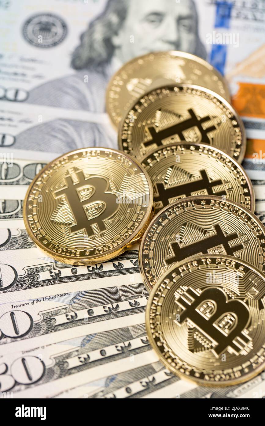 Bitcoin piled up on fifty and one hundred dollar banknotes. Crypto ...