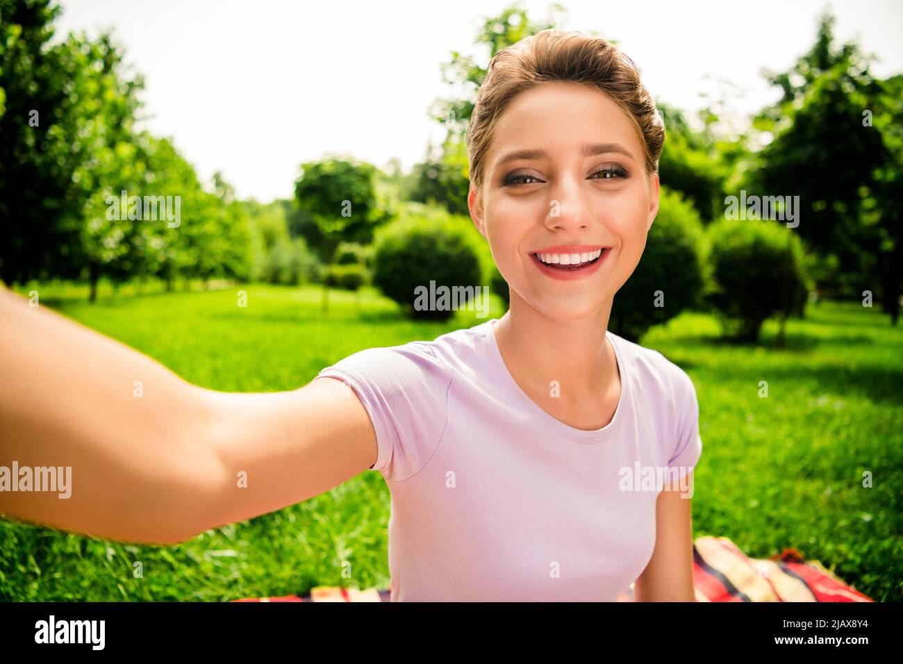 Self-portrait of attractive cheerful girl spending good free time ...