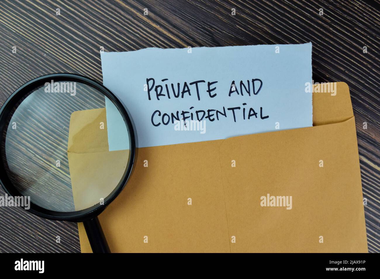 Private and Confidential text on document above brown envelope and ...