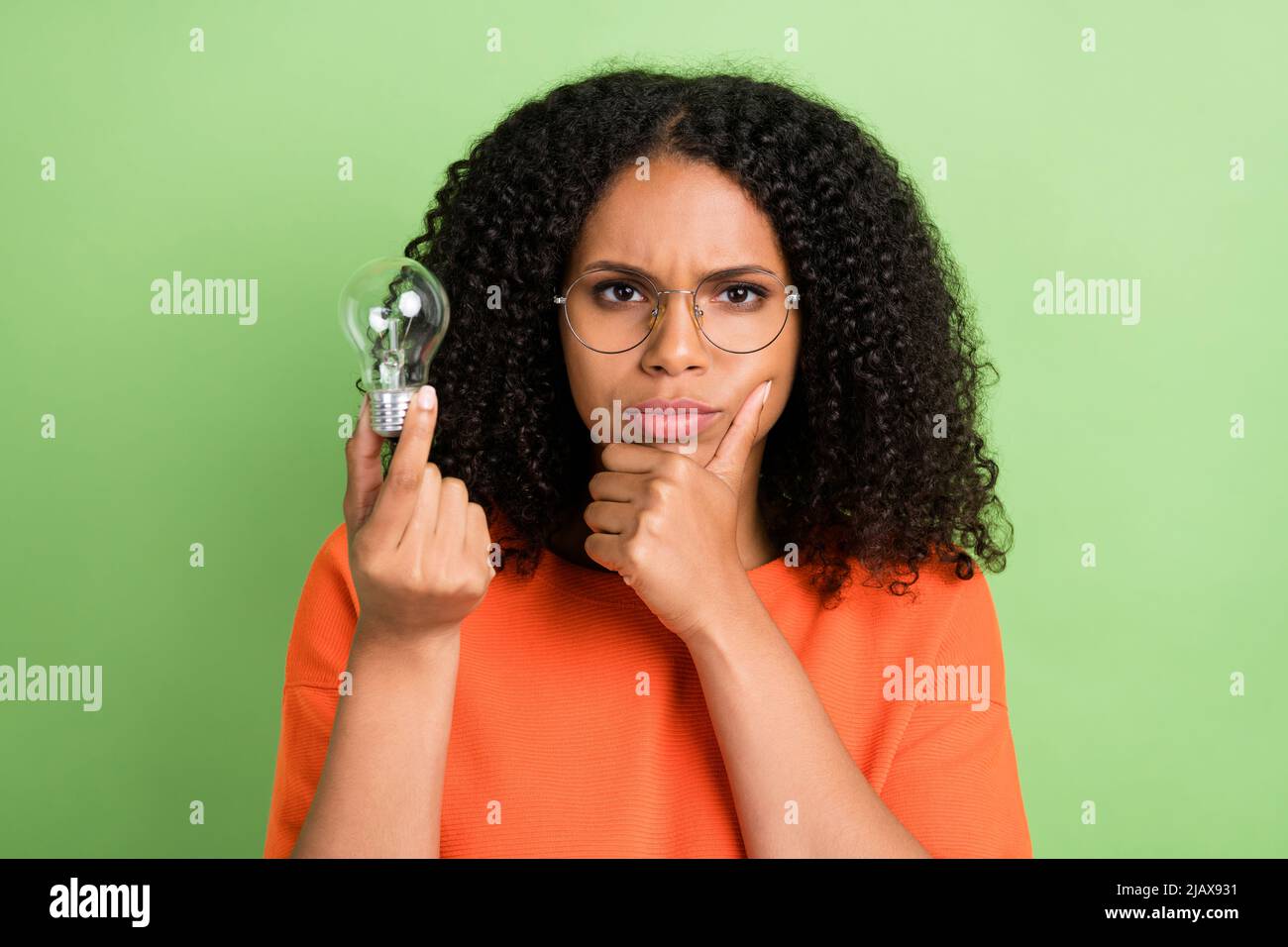 Photo of young african woman serious hand touch chin think deep minded ...