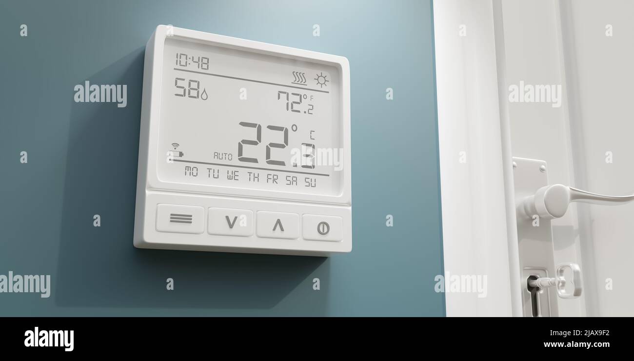Digital thermostat on blue wall background. Home heating temperature ...