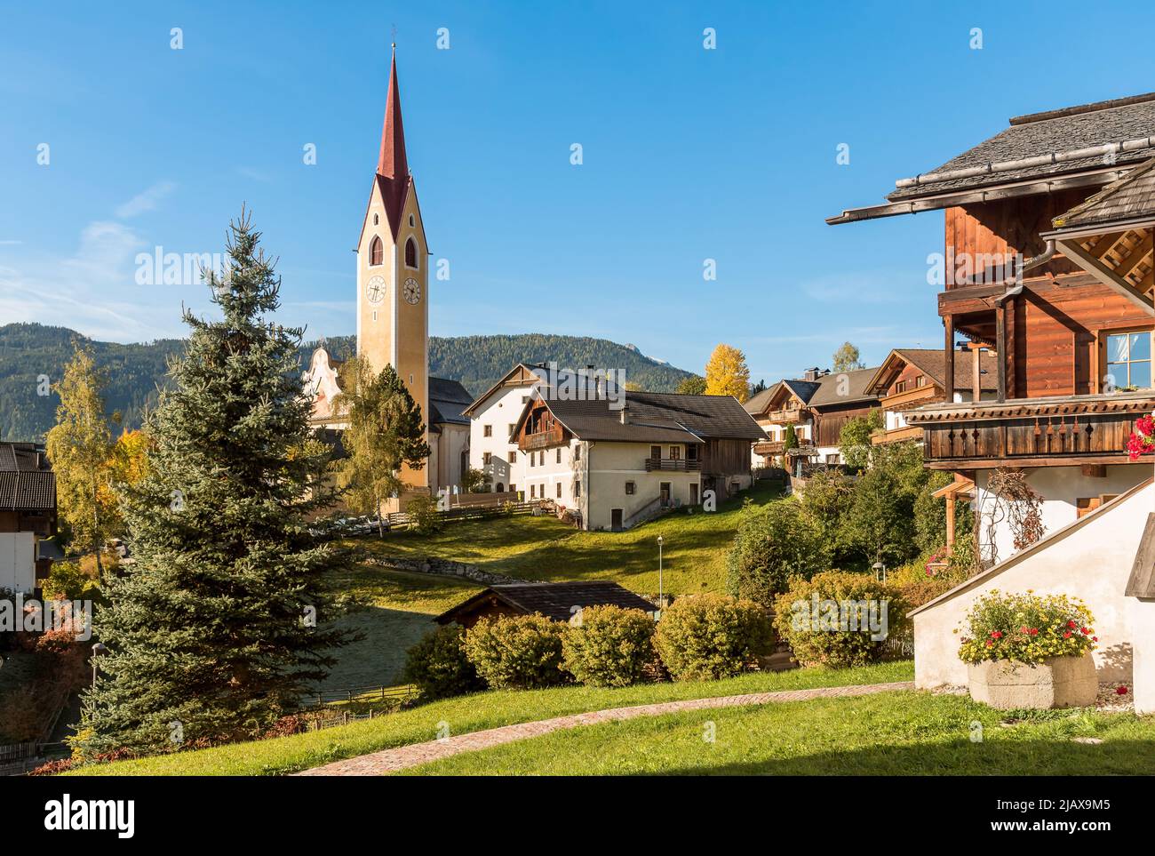View of the Monguelfo-Tesido village with the bell tower of the Parish ...