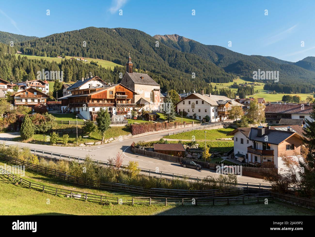 View of the Monguelfo-Tesido village with ancient church of Saint ...