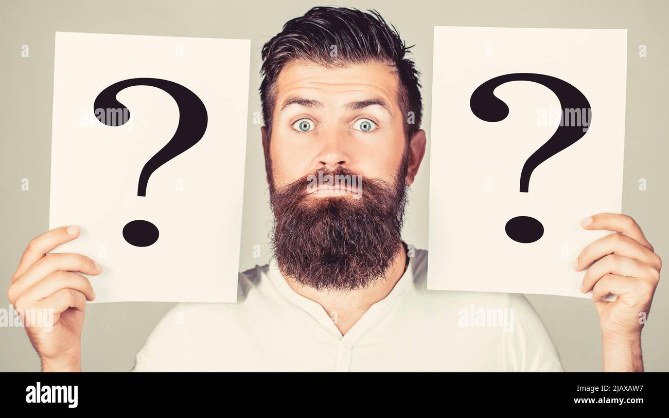 Man with question mark. Paper notes with question marks. Beard man ... Man with question mark. Paper notes with question marks. Beard man ...