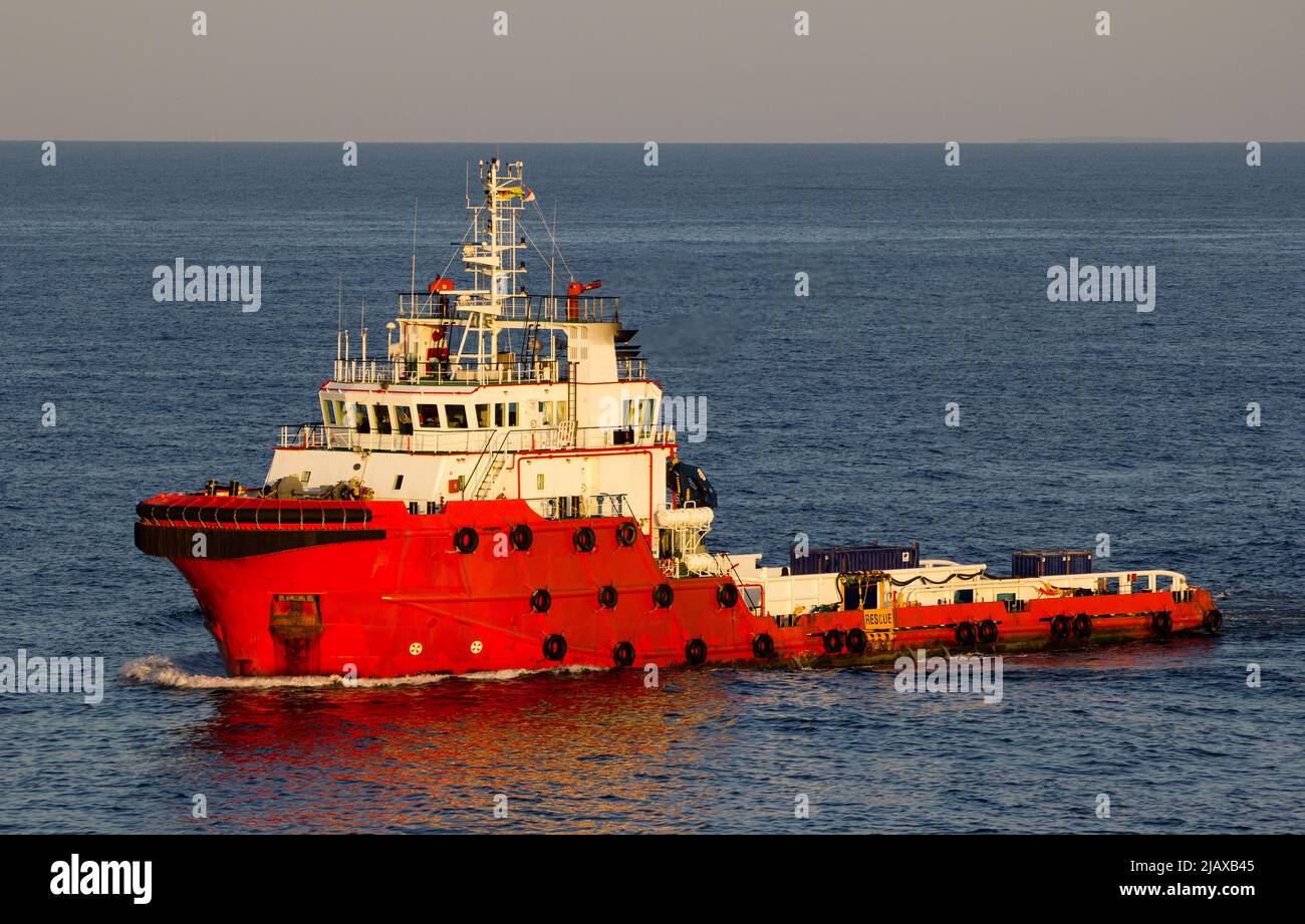 Oil rigs with supply boat boat for transporting people or materials to ...