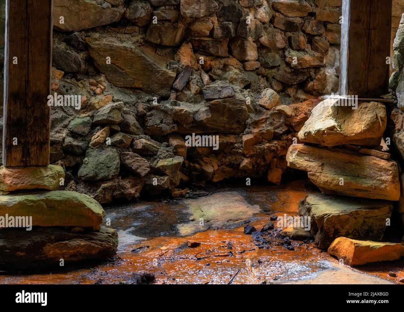 Under Historic Yates Grist Mill foundation supoort of stacked rocks and ...