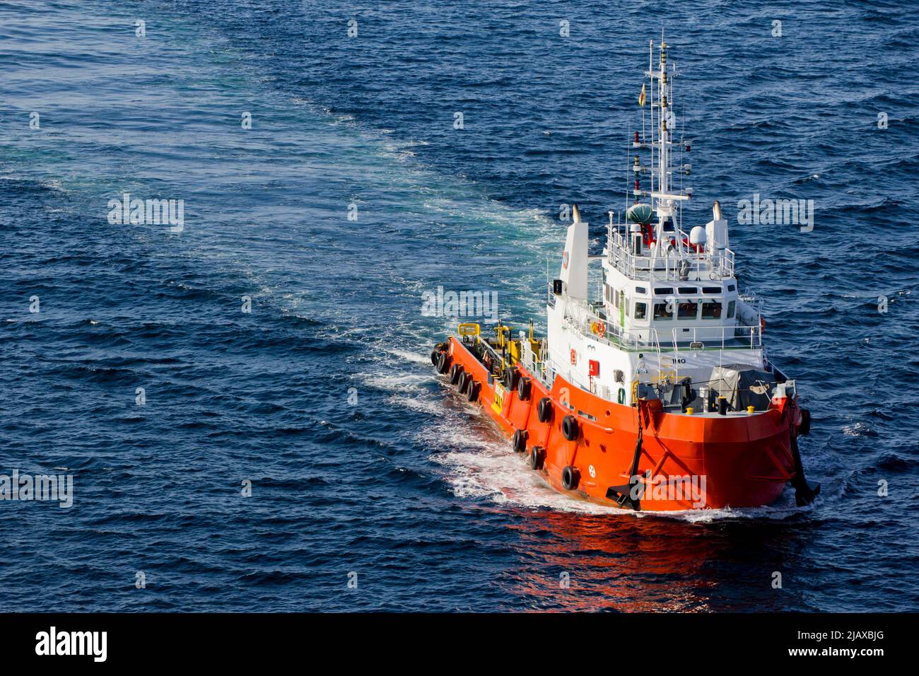 Oil rigs with supply boat boat for transporting people or materials to ...