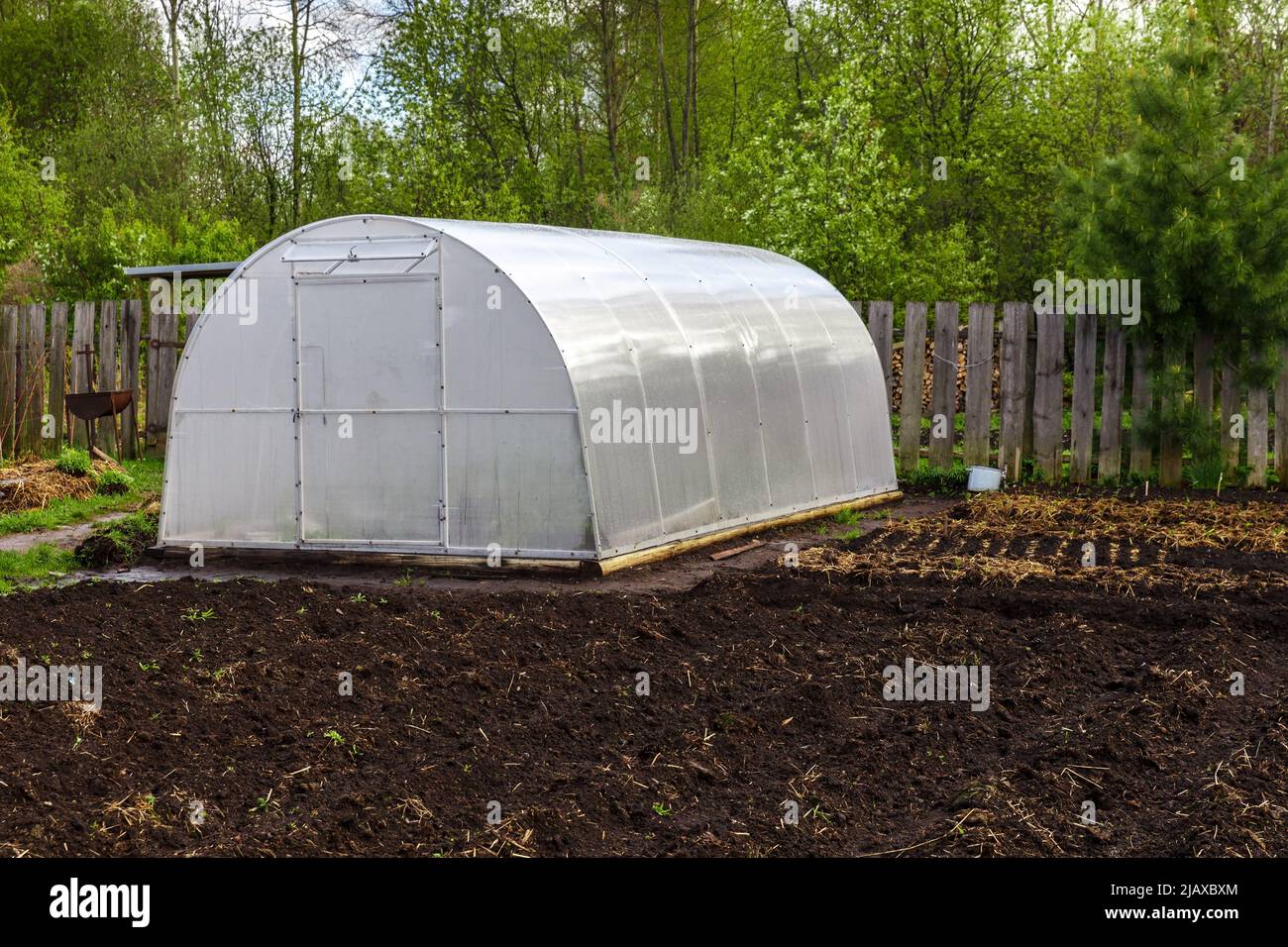 greenhouse in the garden. Polycarbonate greenhouse. Spring Stock Photo ...