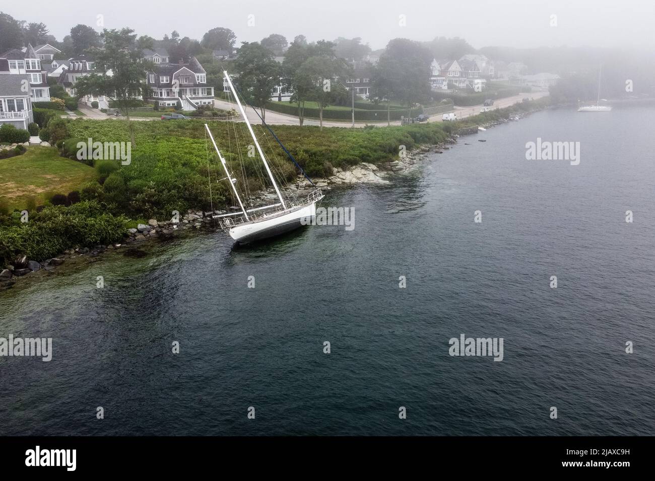 boat damage,capsize,boat ashore,sailboat,fog,dock with boats,Jamestown ...