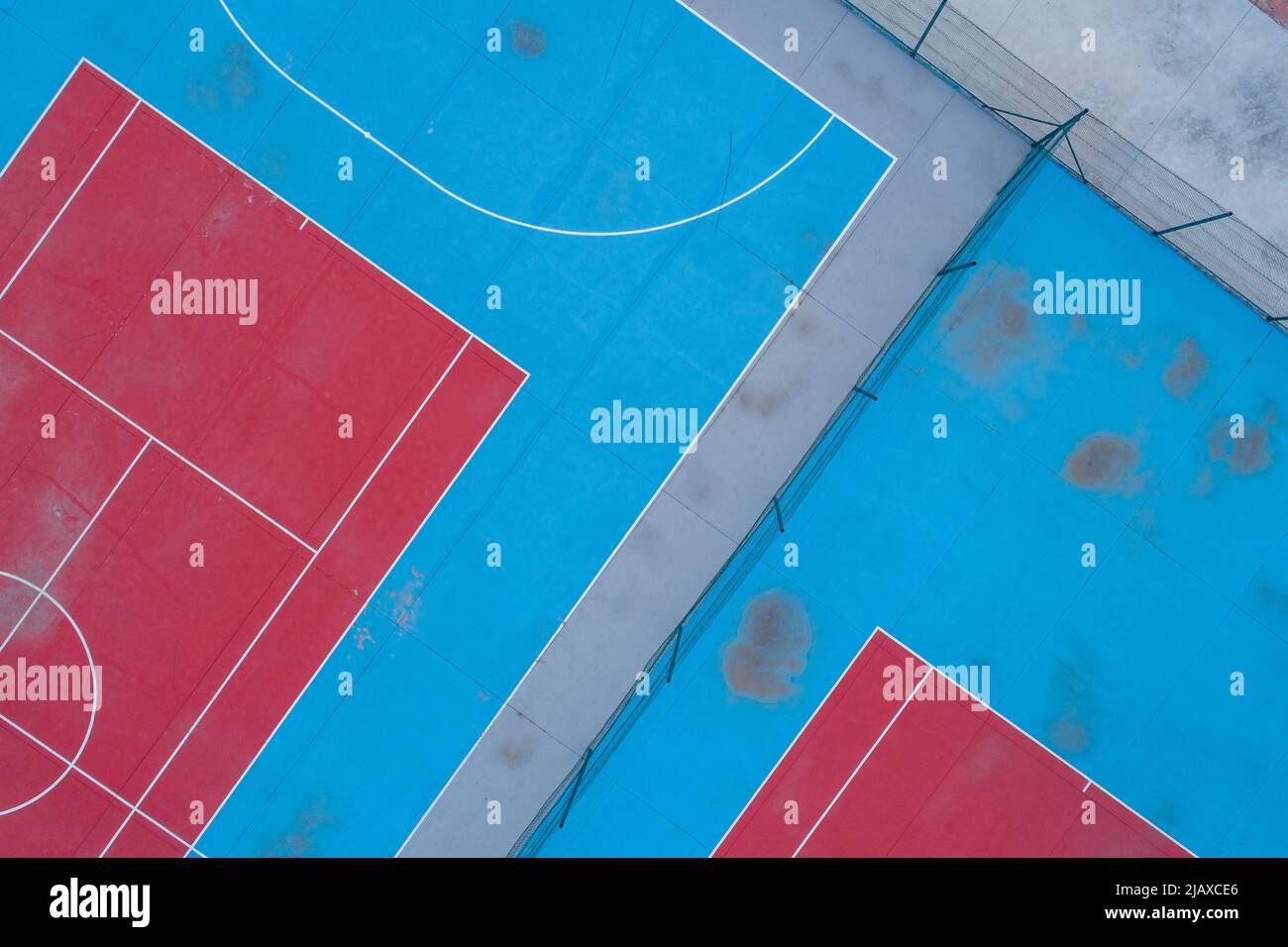 Aerial view of a red and blue futsal and tennis courts Stock Photo - Alamy
