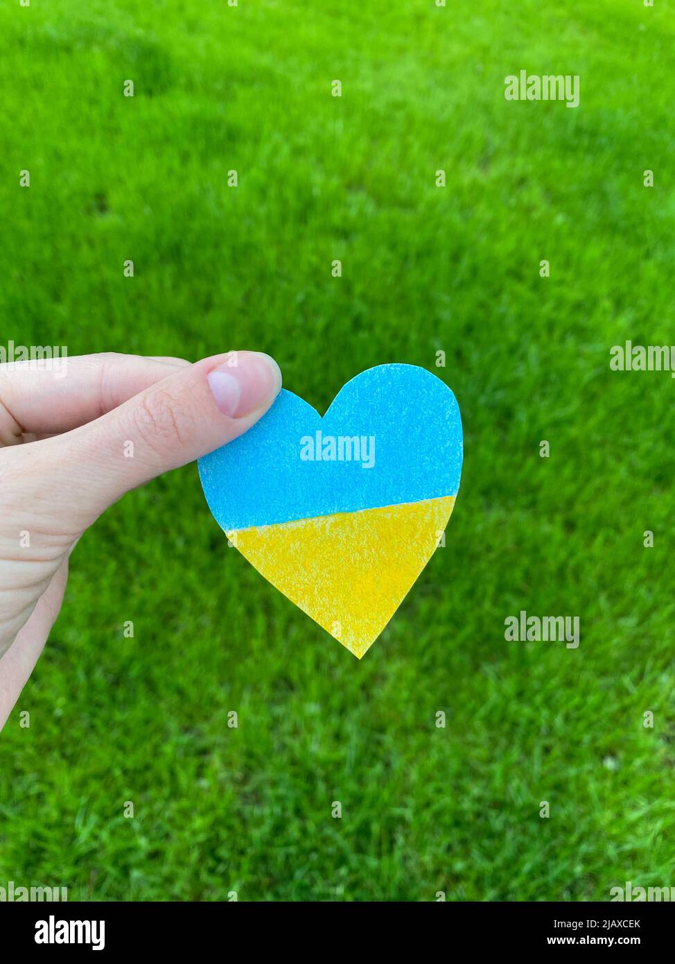 Concept of ending the war in Ukraine. Flag shape heart Stock Photo - Alamy