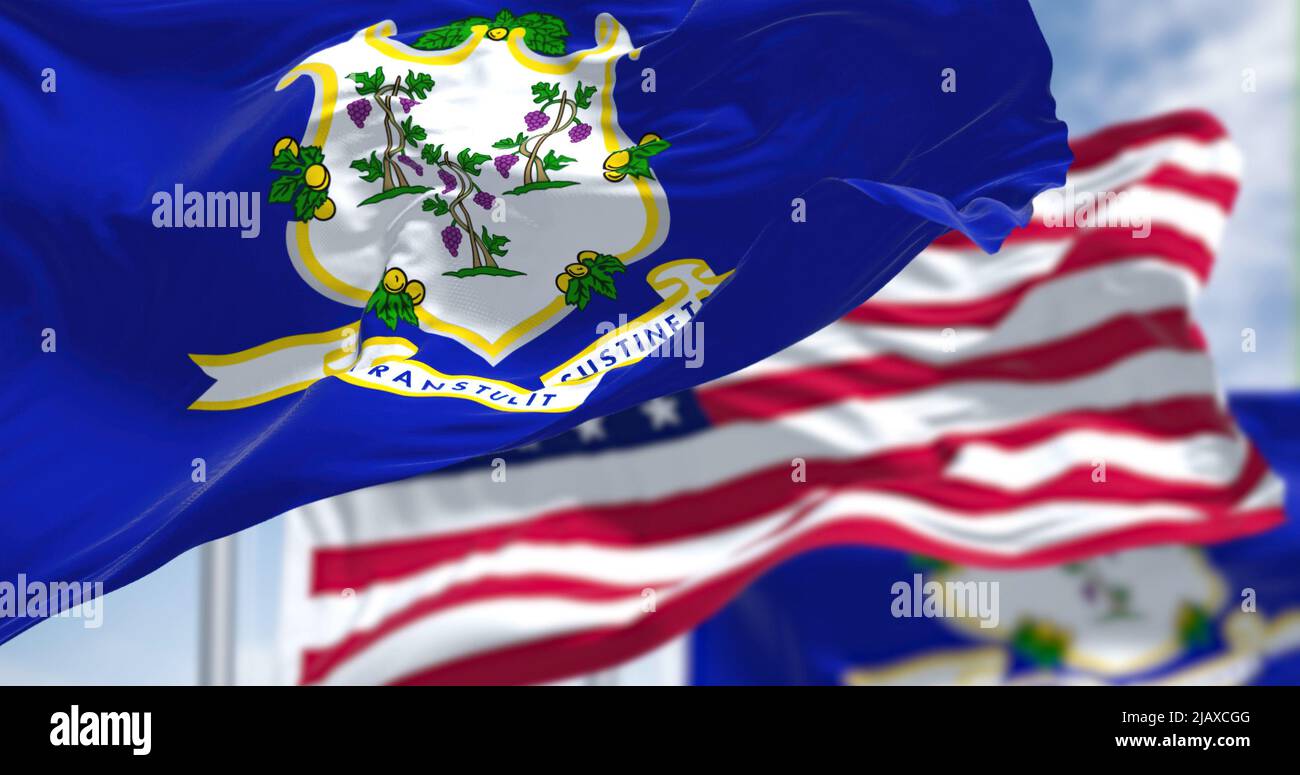 Two Connecticut state flags waving along with the national flag of the ...