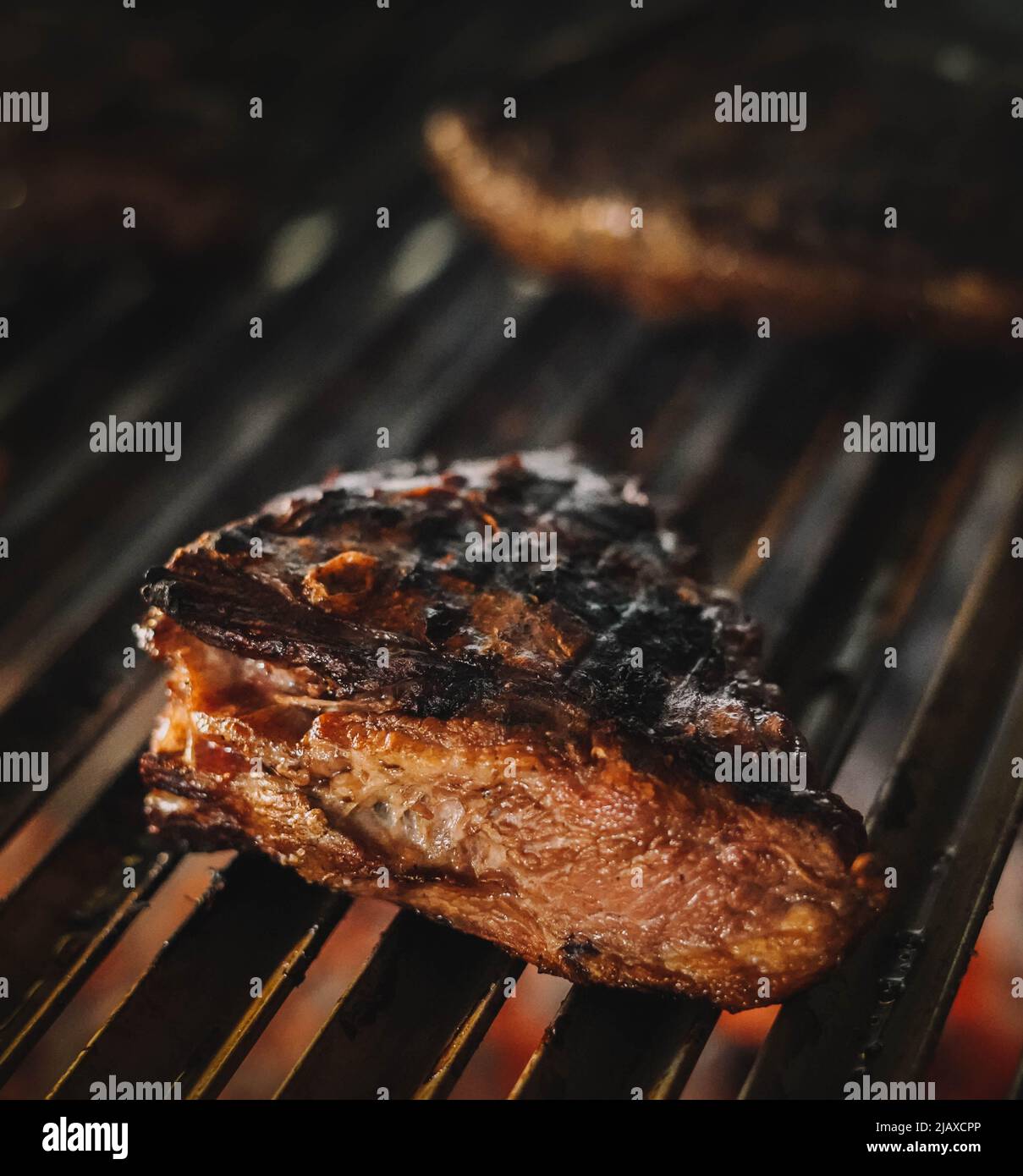 Nice chunks of beef on a charcoal grill Stock Photo - Alamy