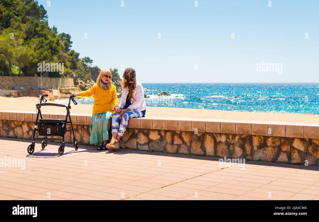 Woman and elderly mother beach walk hi-res stock photography and images ...